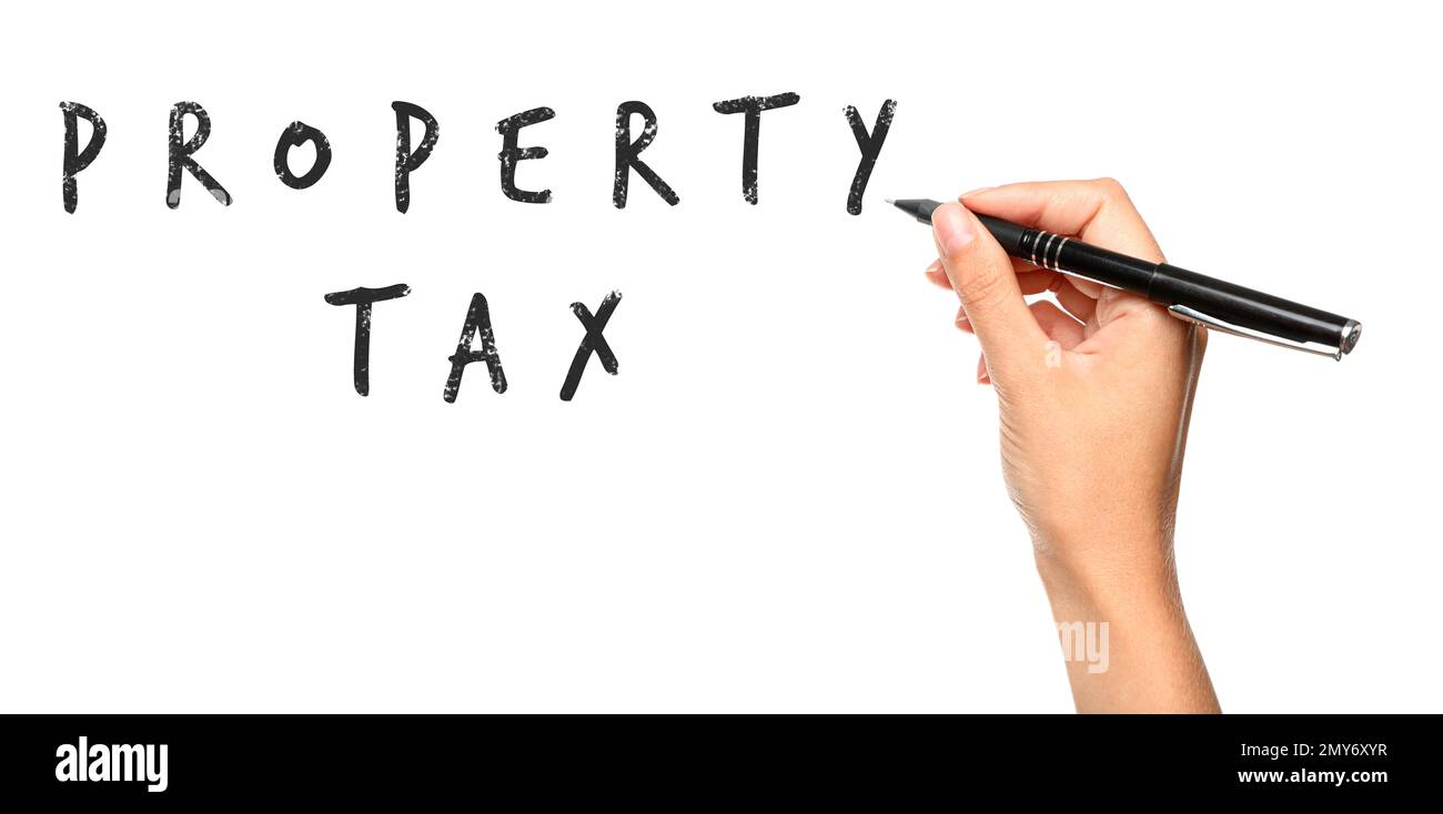 Woman writing phrase Property Tax on white background, closeup. Banner ...