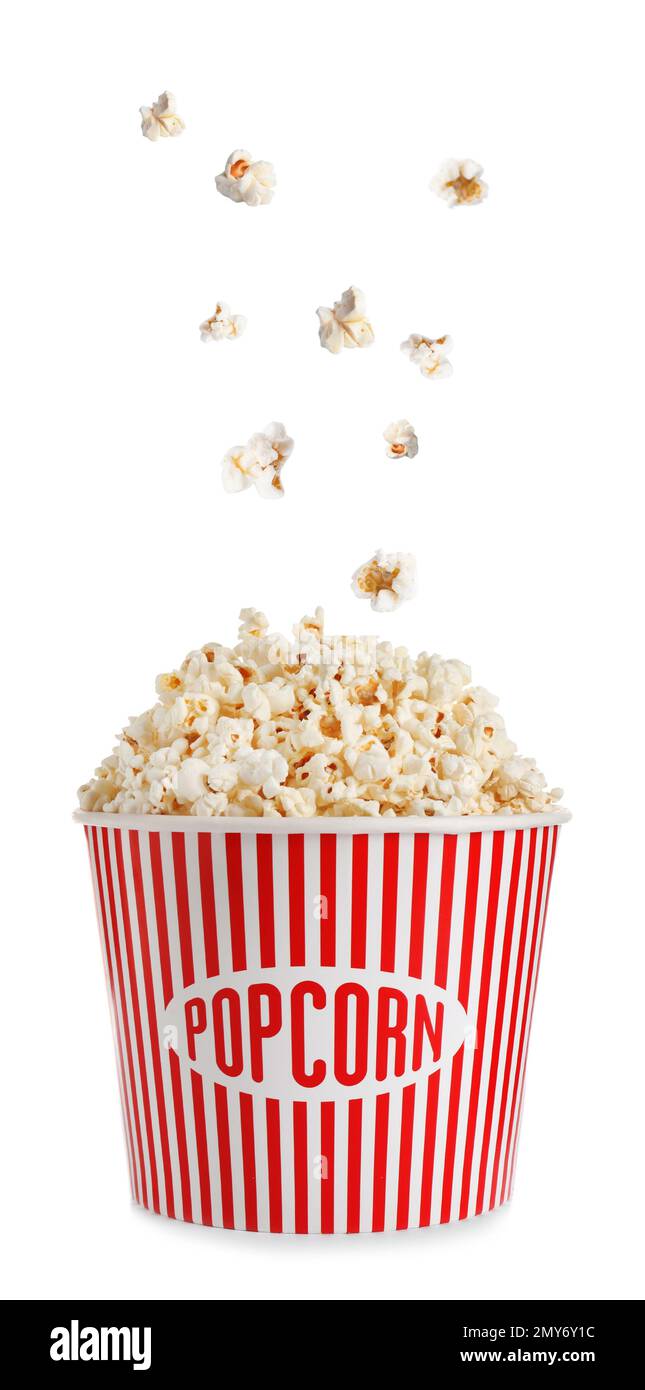 Hot popcorn falling into paper bucket on white background Stock Photo ...