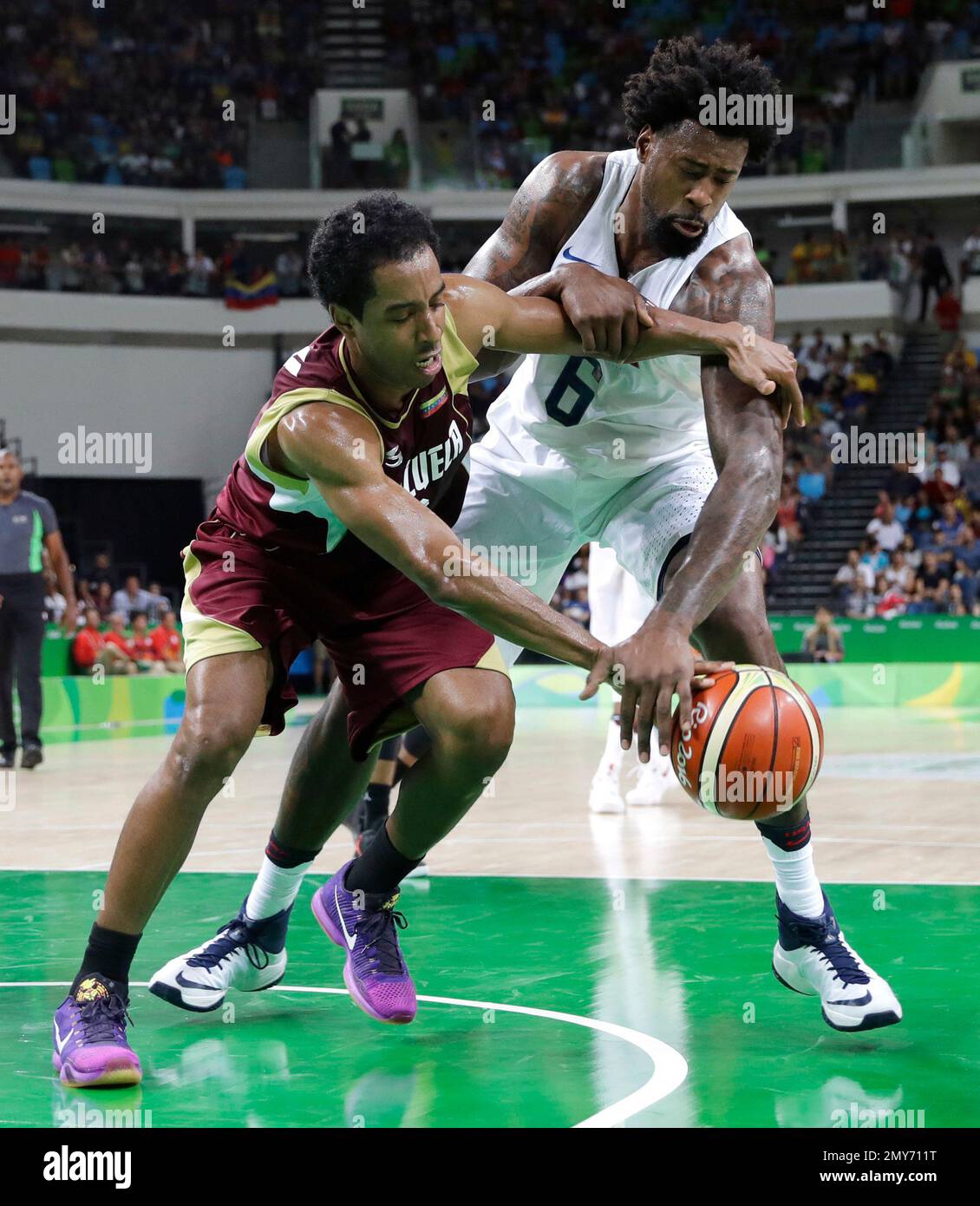 Venezuela's John Cox, left, and United States' DeAndre Jordan, right ...
