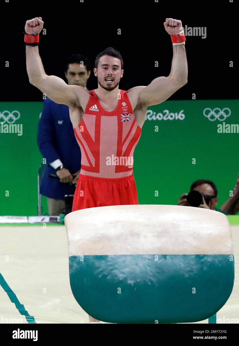 Britain's Kristian Thomas celebrates after his routine on the vault ...