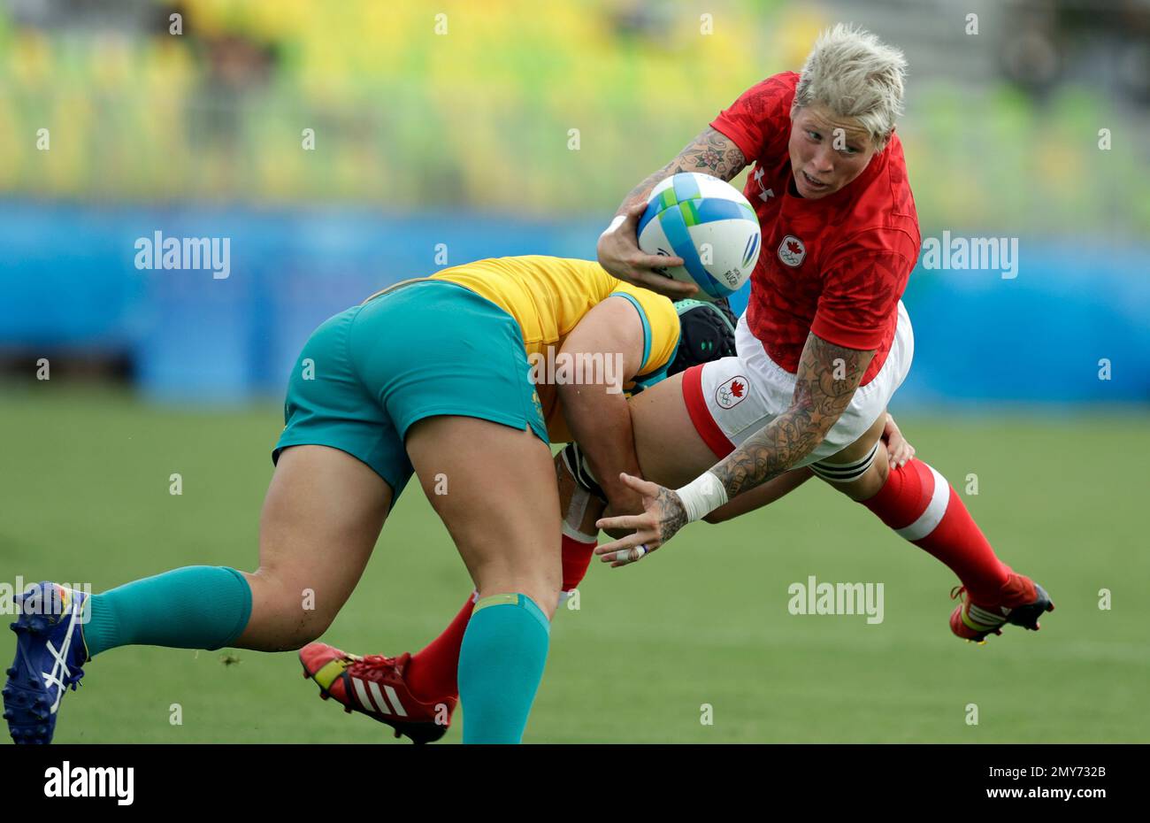 Canada's Jennifer Kish, right, is tackled by Australia's Sharni ...