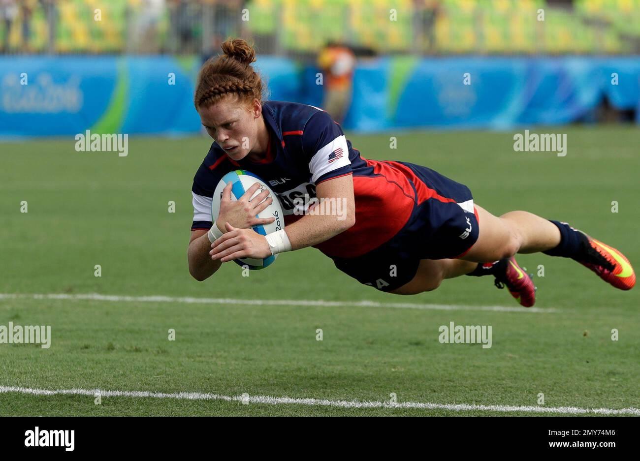 USA's Alev Kelter, scores a try during the women's rugby sevens match ...