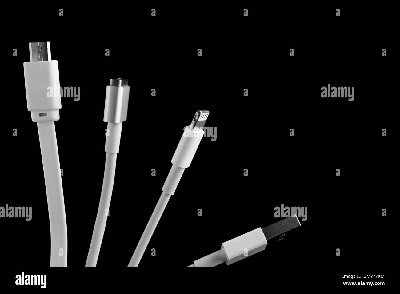 Charge cables on black background, closeup. Space for text Stock Photo ...