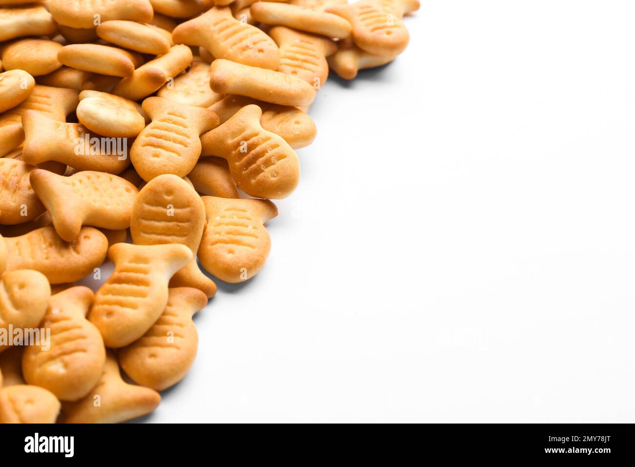 Delicious crispy goldfish crackers on white background, closeup Stock ...