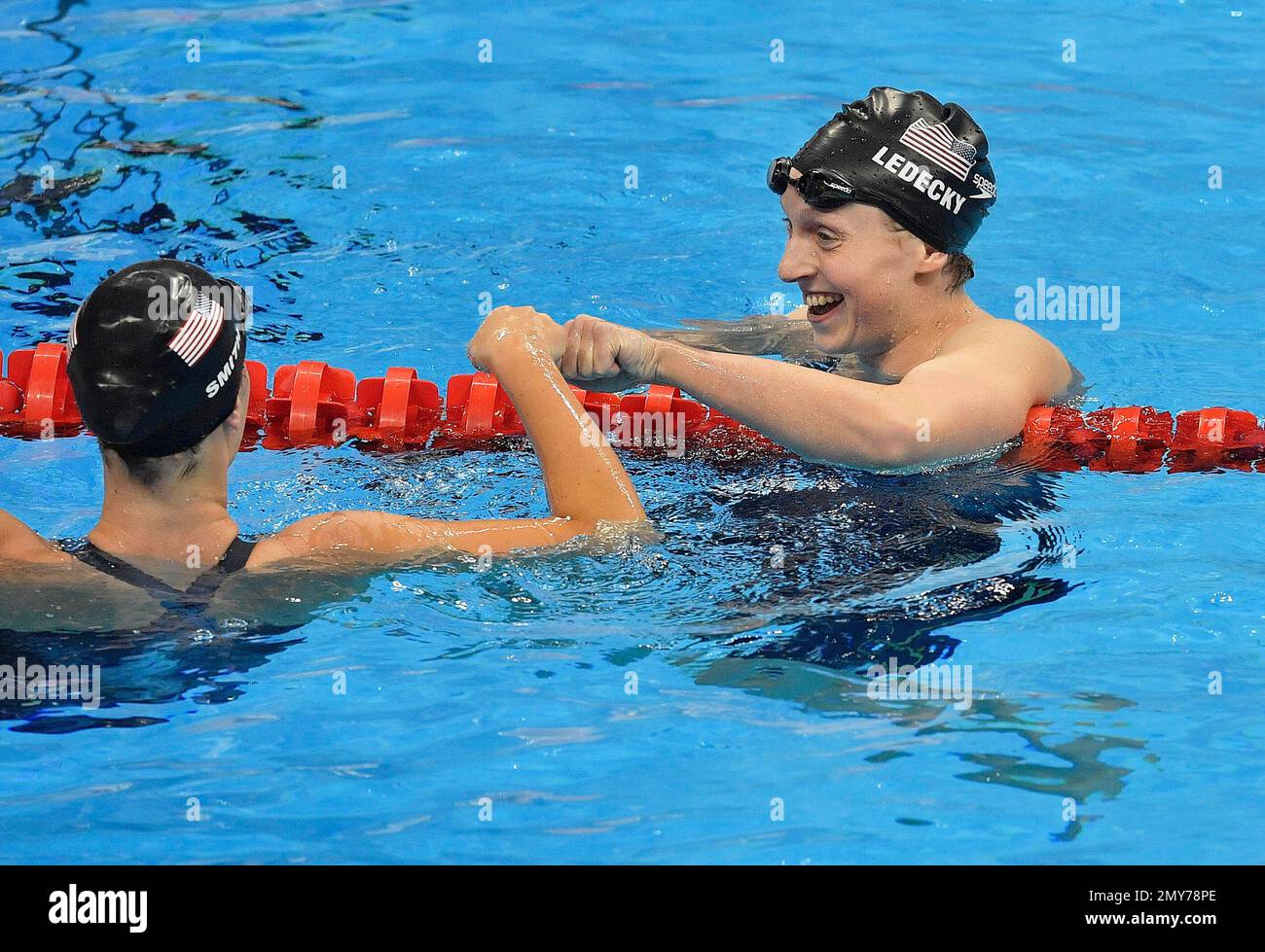 United States' Katie Ledecky, right, celebrates with United States ...