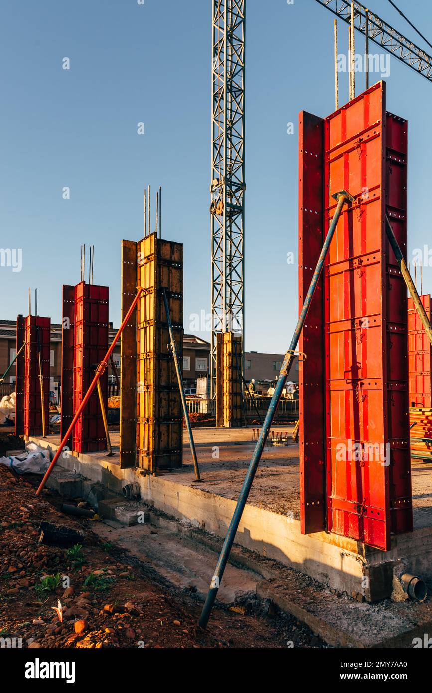 Construction site with steel formworks and reinforcing bars for pillars ...