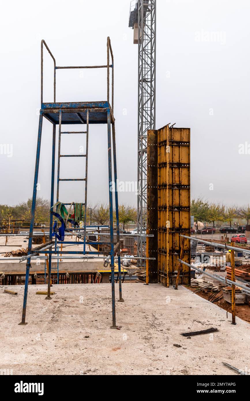 Construction site with steel formworks and reinforcing bars for pillars ...