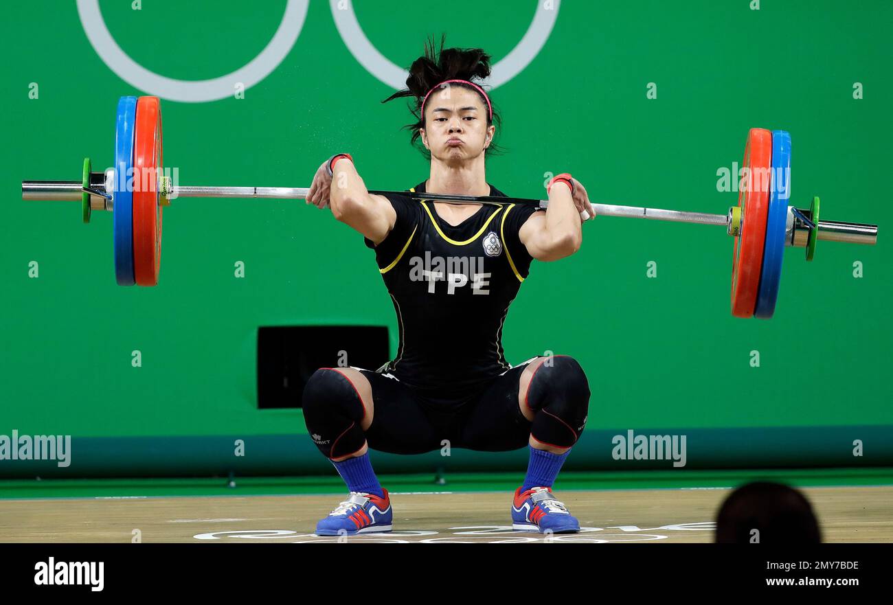 Hsu Shu-Ching, of Taiwan, competes in the women's 53kg weightlifting ...