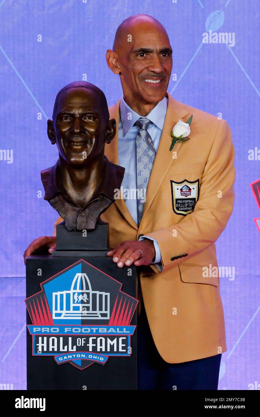 Former NFL coach and player Tony Dungy poses with his Hall of Fame bust ...