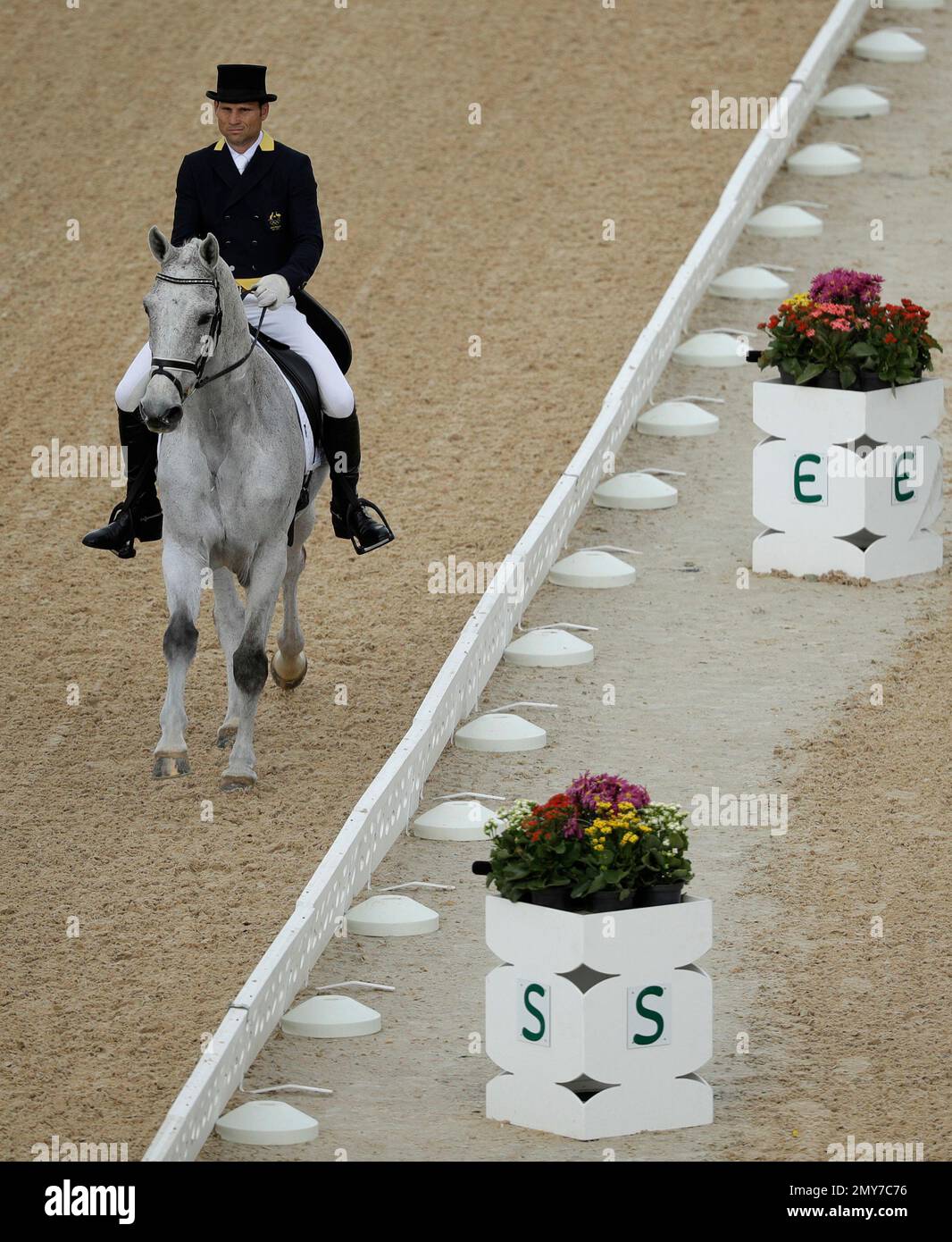 Shane Rose, of Australia, rides Cp Qualified in the equestrian eventing ...