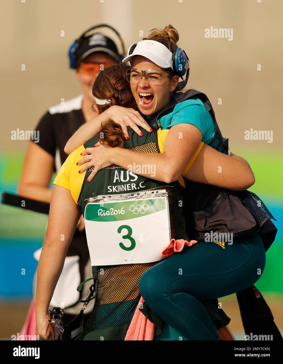 Catherine Skinner, left, of Australia celebrates her victory with her ...