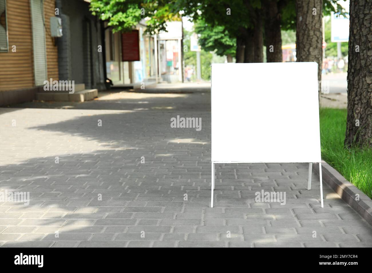 Blank advertising board on city street. Space for design Stock Photo ...