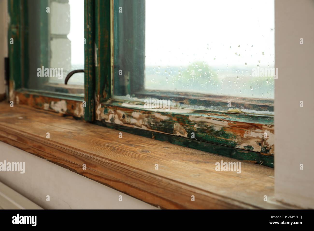 Old window with wooden sill in room, closeup Stock Photo - Alamy