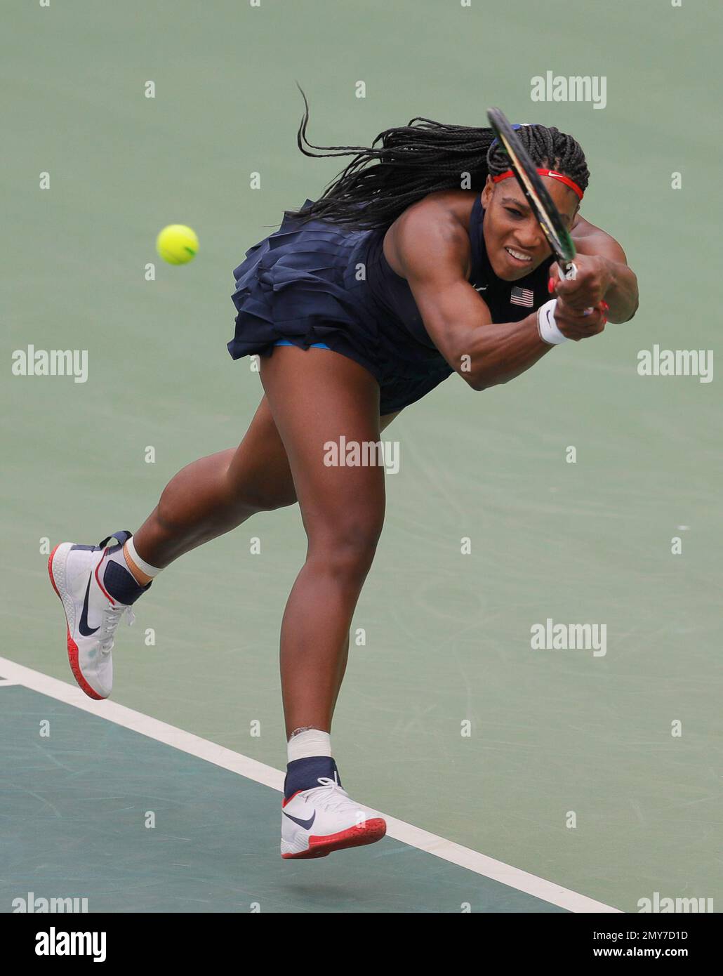 Serena Williams of the United States returns a ball to Australia's ...