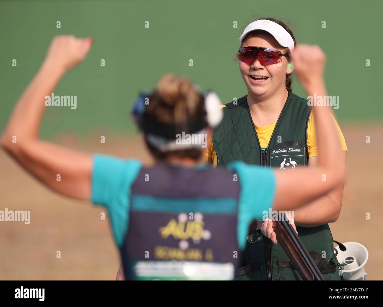 Catherine Skinner, right, of Australia celebrates her victory with her ...