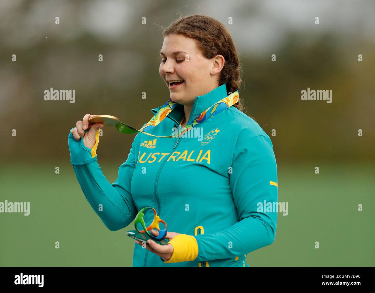 Catherine Skinner of Australia checks her gold medal following the ...