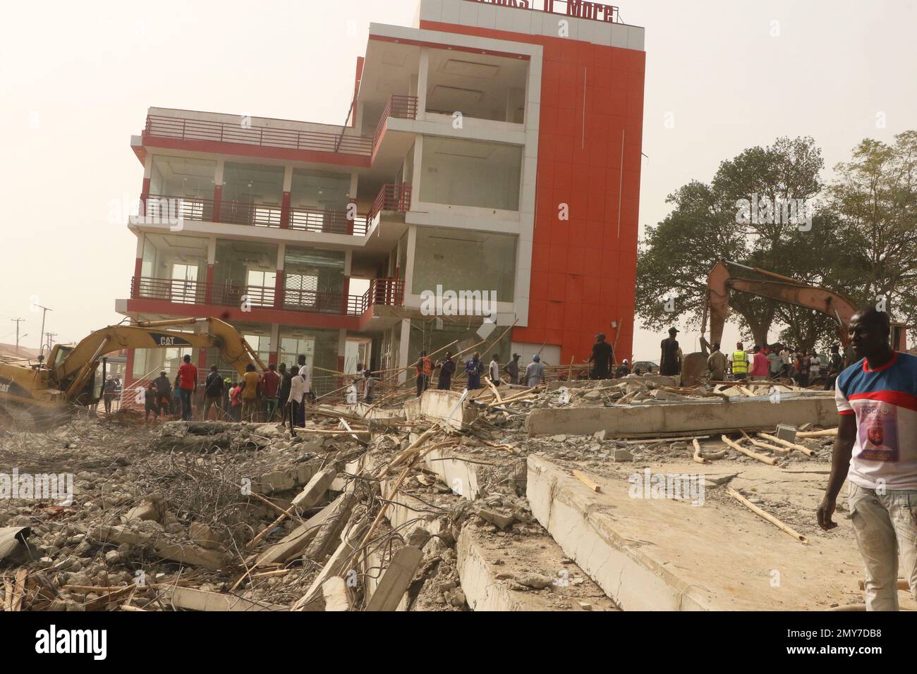 Rescue teams at the site of a 2-story building under construction that ...