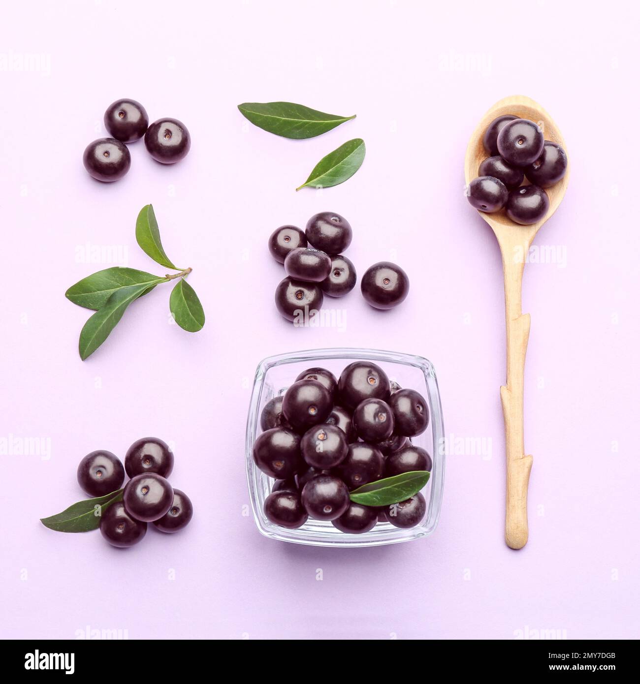 Flat lay composition with acai berries on violet background, flat lay ...