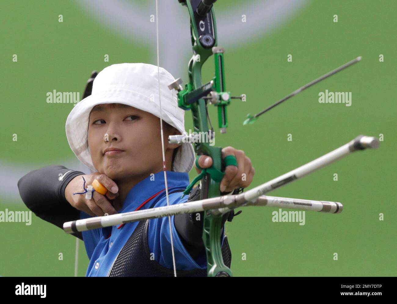 Taiwan's Lin Shih-chia releases her arrow during the women's team ...