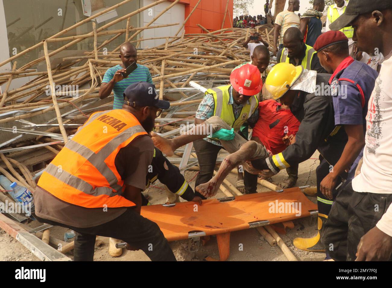 Rescue teams at the site of a 2-story building under construction that ...