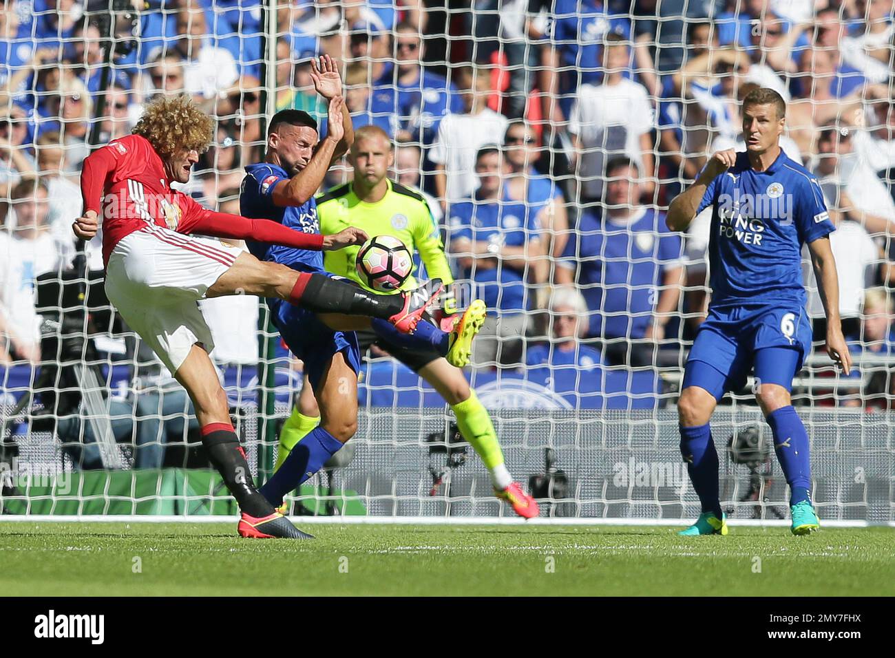 Manchester United's Marouane Fellaini, left, attempts a shot past ...
