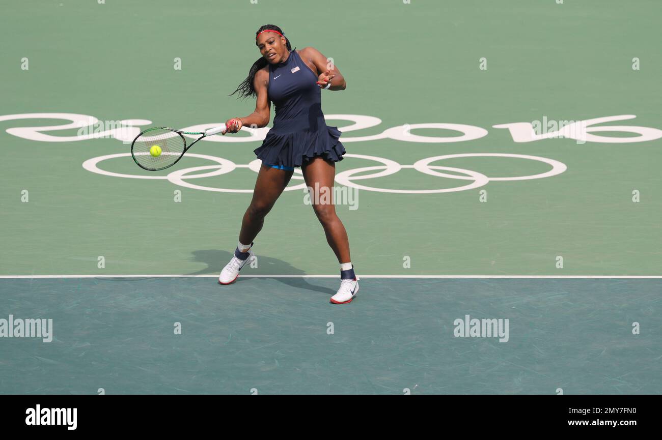 Serena Williams of the United States returns a ball to Australia's ...