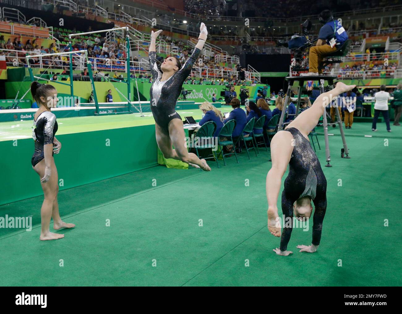 Italian gymnasts warm up for their floor routine during the artistic ...