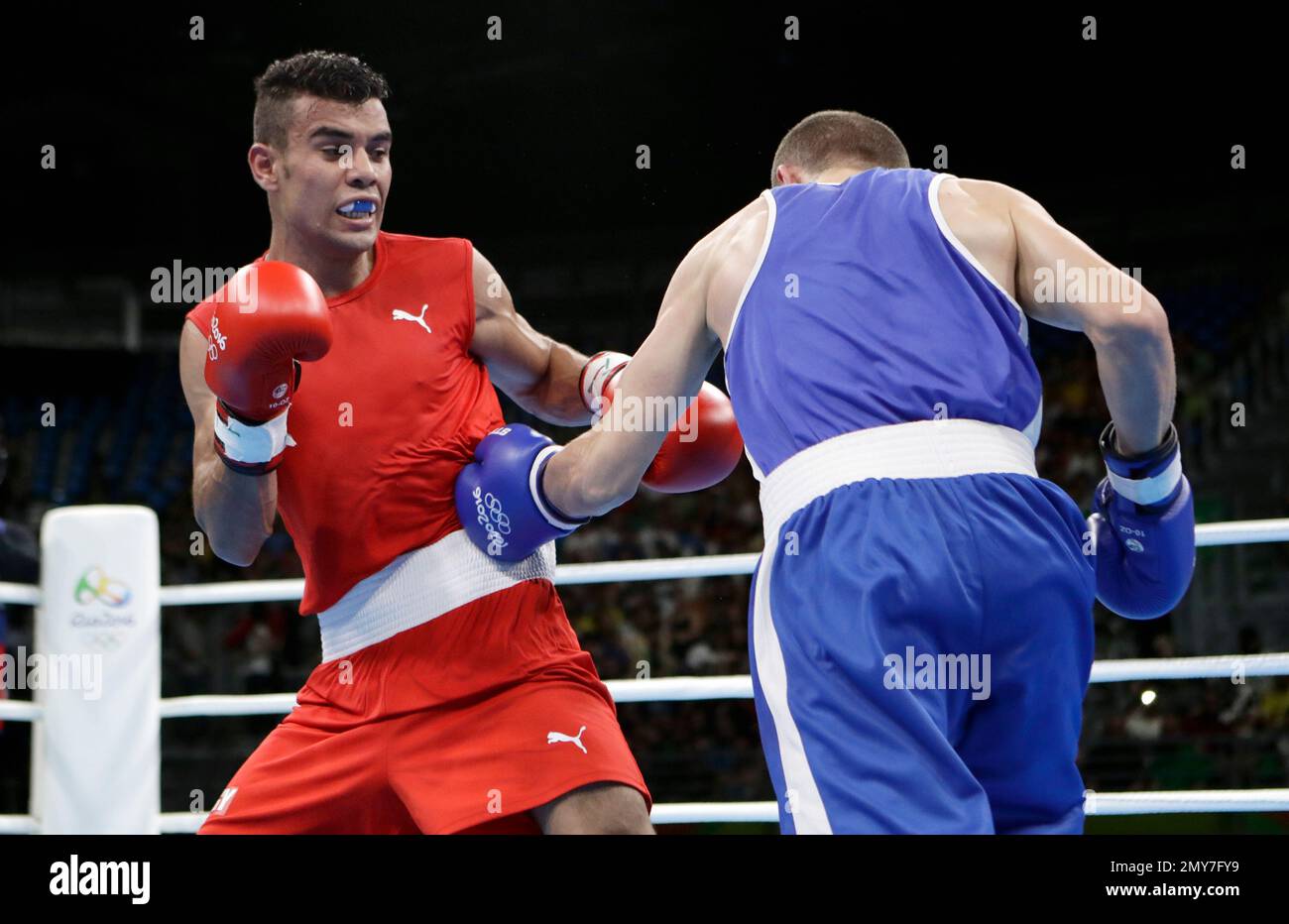 Algeria's Reda Benbaziz, right, fights Egypt's Mahmoud Abdelaal during ...