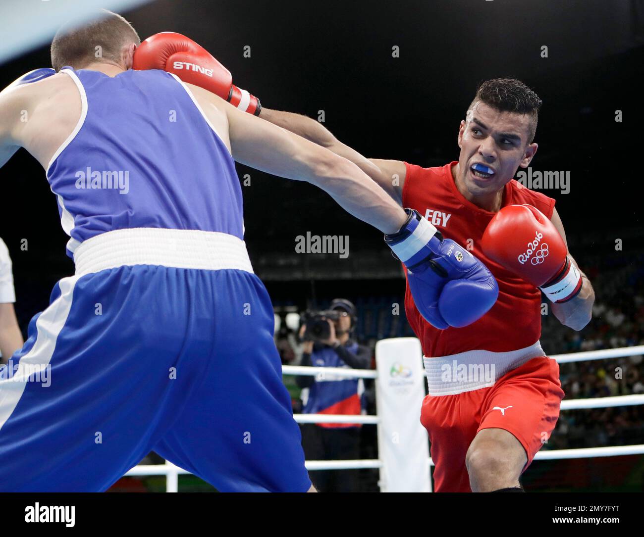 Egypt's Mahmoud Abdelaal, right, fights Algeria's Reda Benbaziz during ...