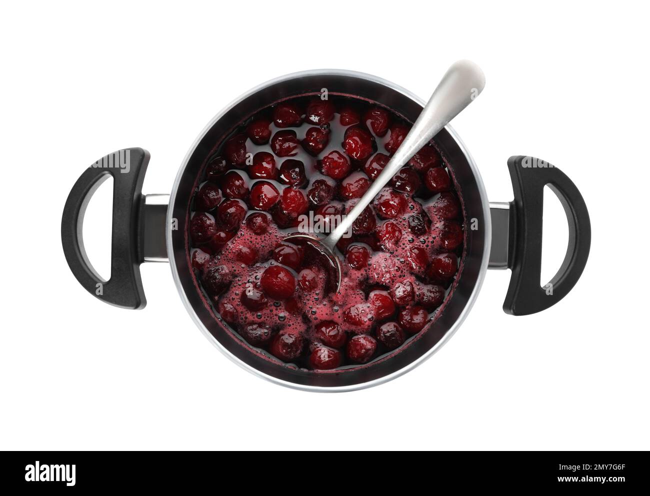 Pot with cherries in sugar syrup on white background, top view. Making ...