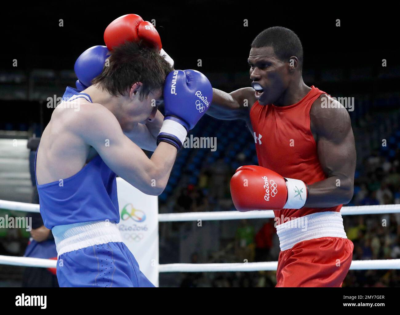 Papua New Guinea's Thadius Katua, right, fights Russia's Adlan ...