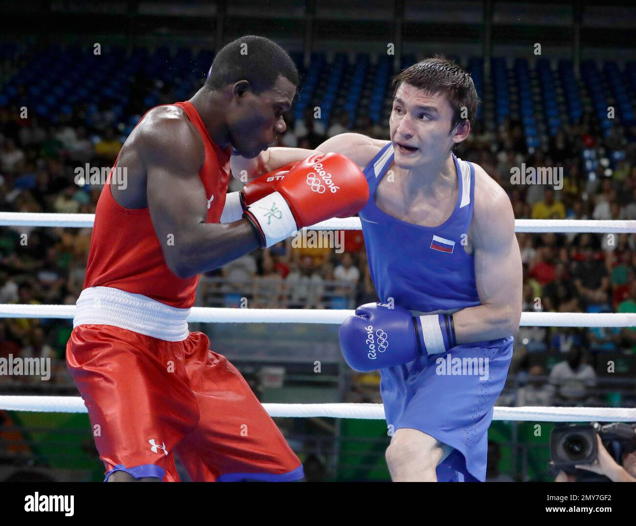 Russia's Adlan Abdurashidov, right, fights Papua New Guinea's Thadius ...