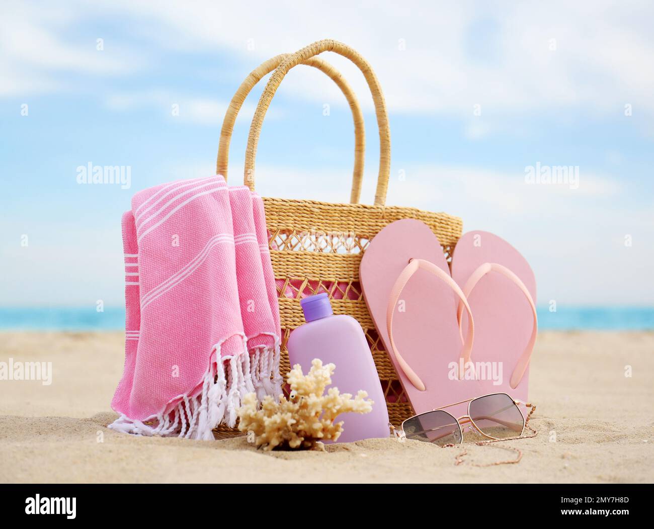 Different stylish beach objects and coral on sand near sea Stock Photo ...