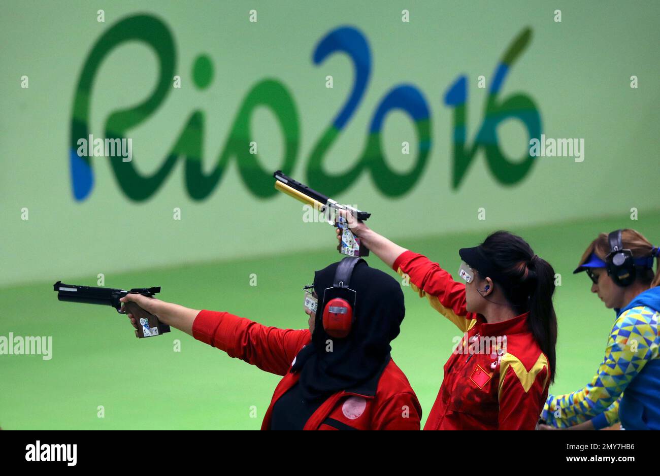Athletes compete during the women's 10-meter air pistol qualification ...