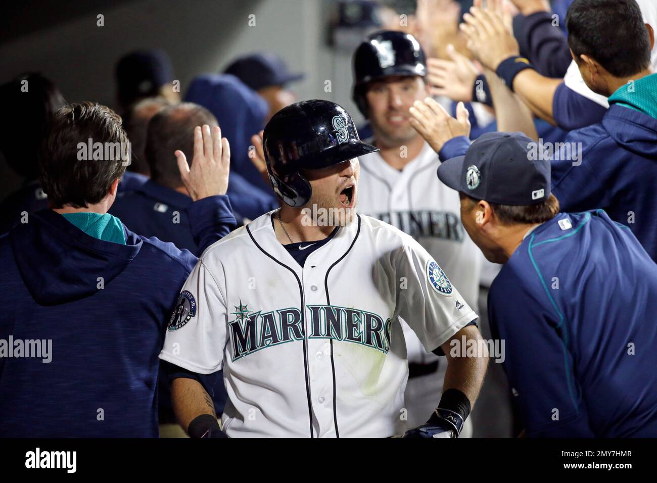 Seattle Mariners' Shawn O'Malley lets out a yell after hitting a three ...