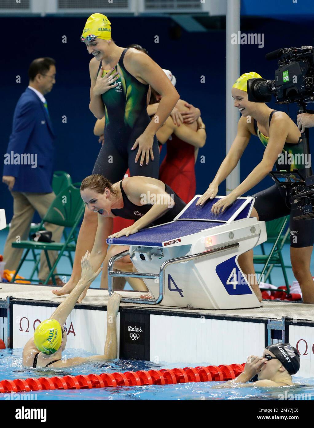 Australia's Cate Campbell, is greeted by teammates after anchoring the ...