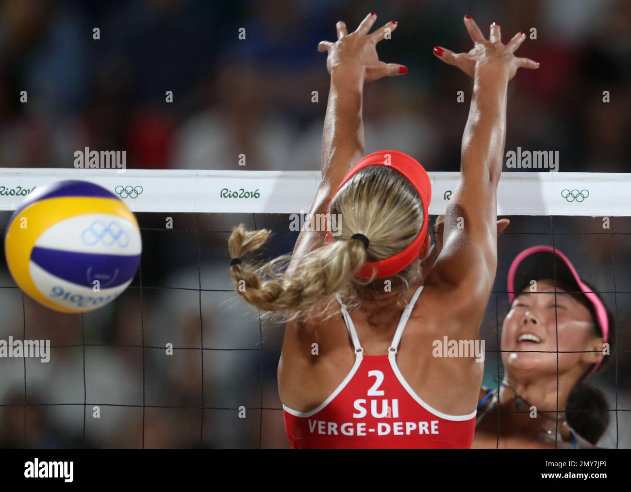 Switzerland's Anouk Verge-Depre, left, fails to block China's Wang Fan ...