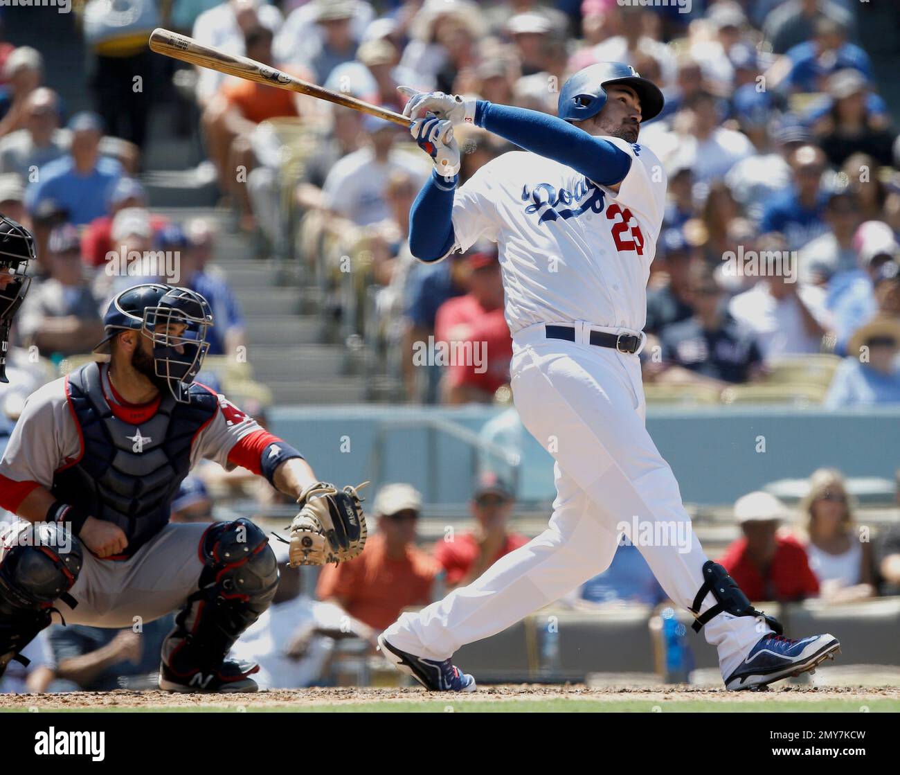 Los Angeles Dodgers' Adrian Gonzalez, right, hits a run scoring single ...