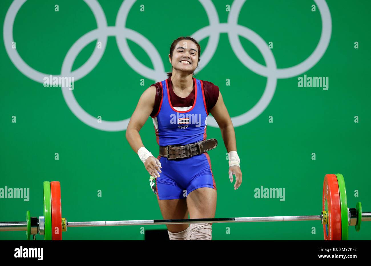 Sopita Tanasan, of Thailand, drops the bar after a successful lift in ...