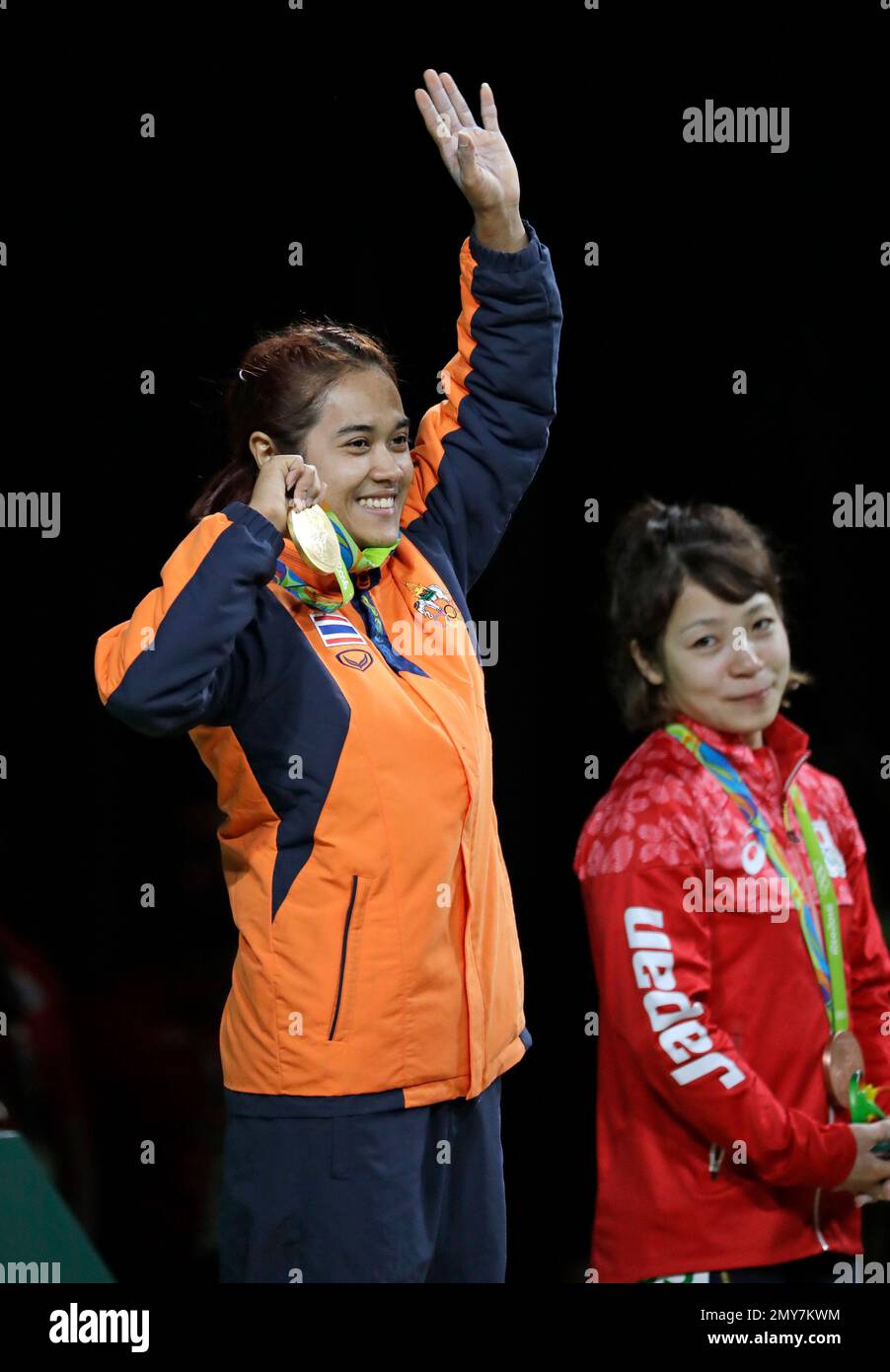Sopita Tanasan, of Thailand, left, waves to fans after being presented ...