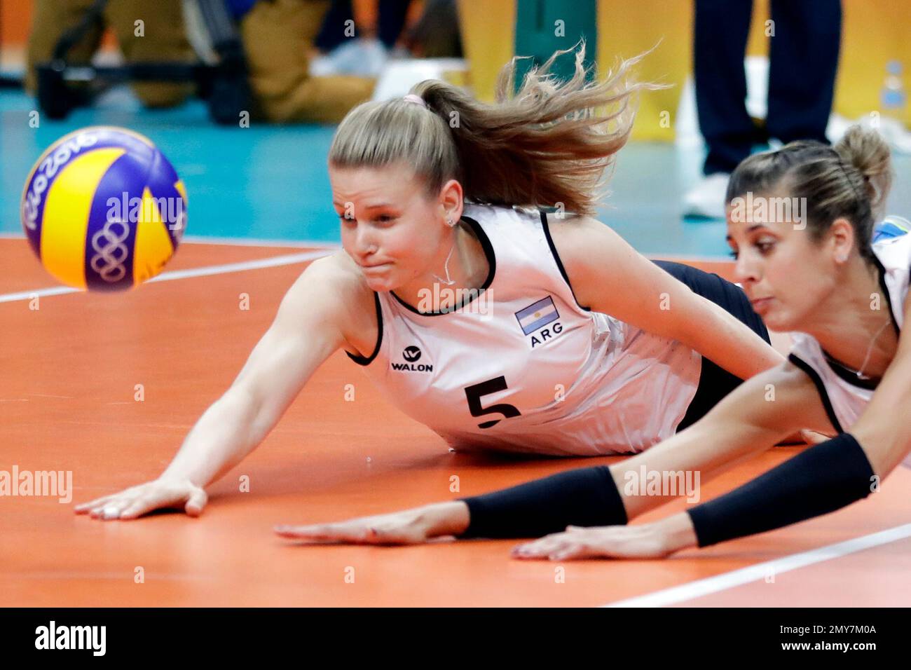 Argentina's Lucia Fresco, left, and Yael Castiglione dive for a ball ...