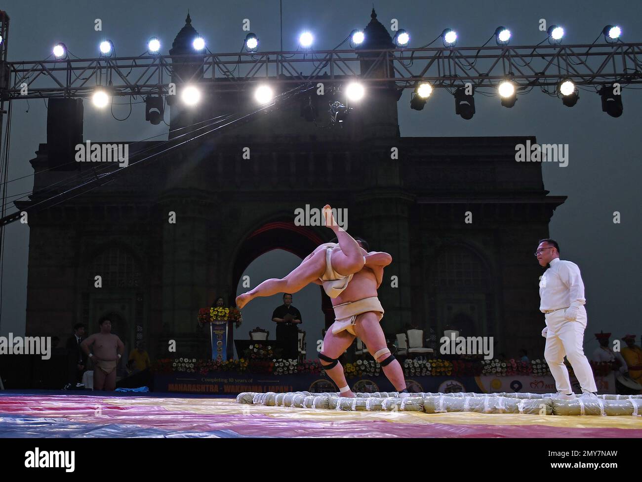 Japanese Sumo wrestlers demonstrate a wrestling move at the signing of ...