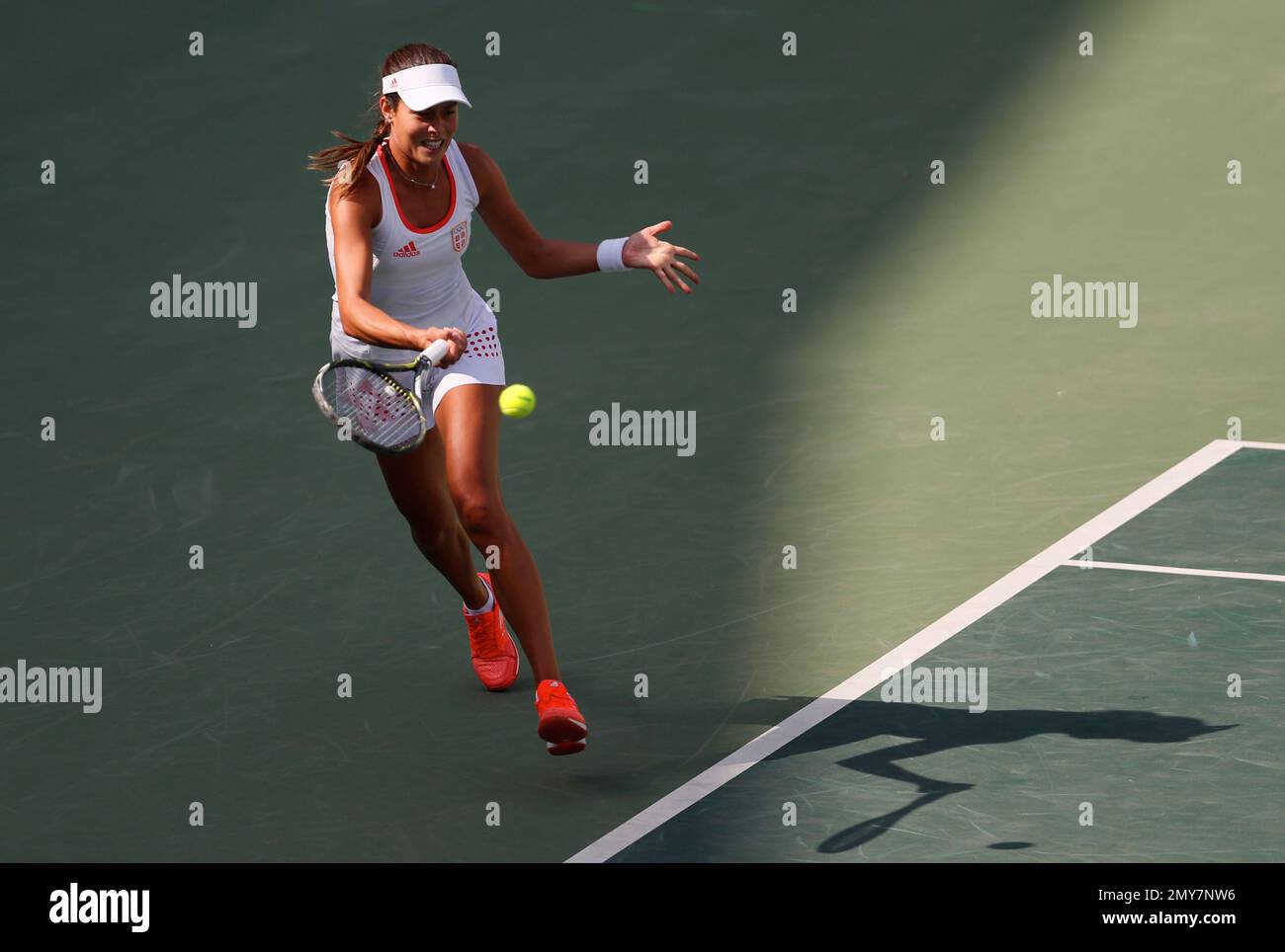 Serbia's Ana Ivanovic returns a ball to Spain's Carla Suarez Navarro in ...