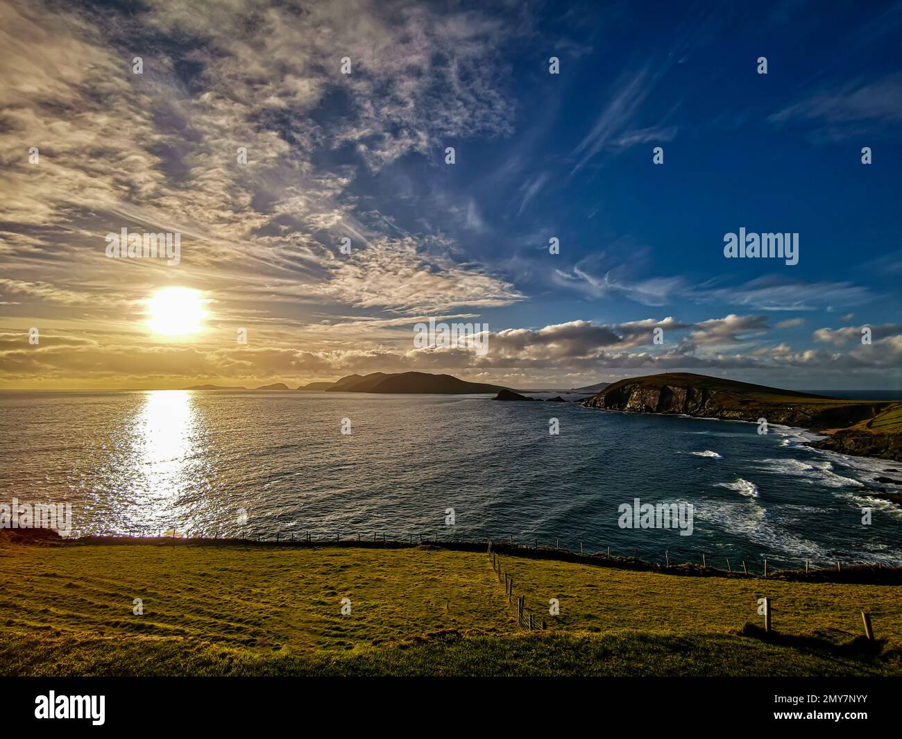 A beautiful seascape view with white and blue foamy waves against a ...