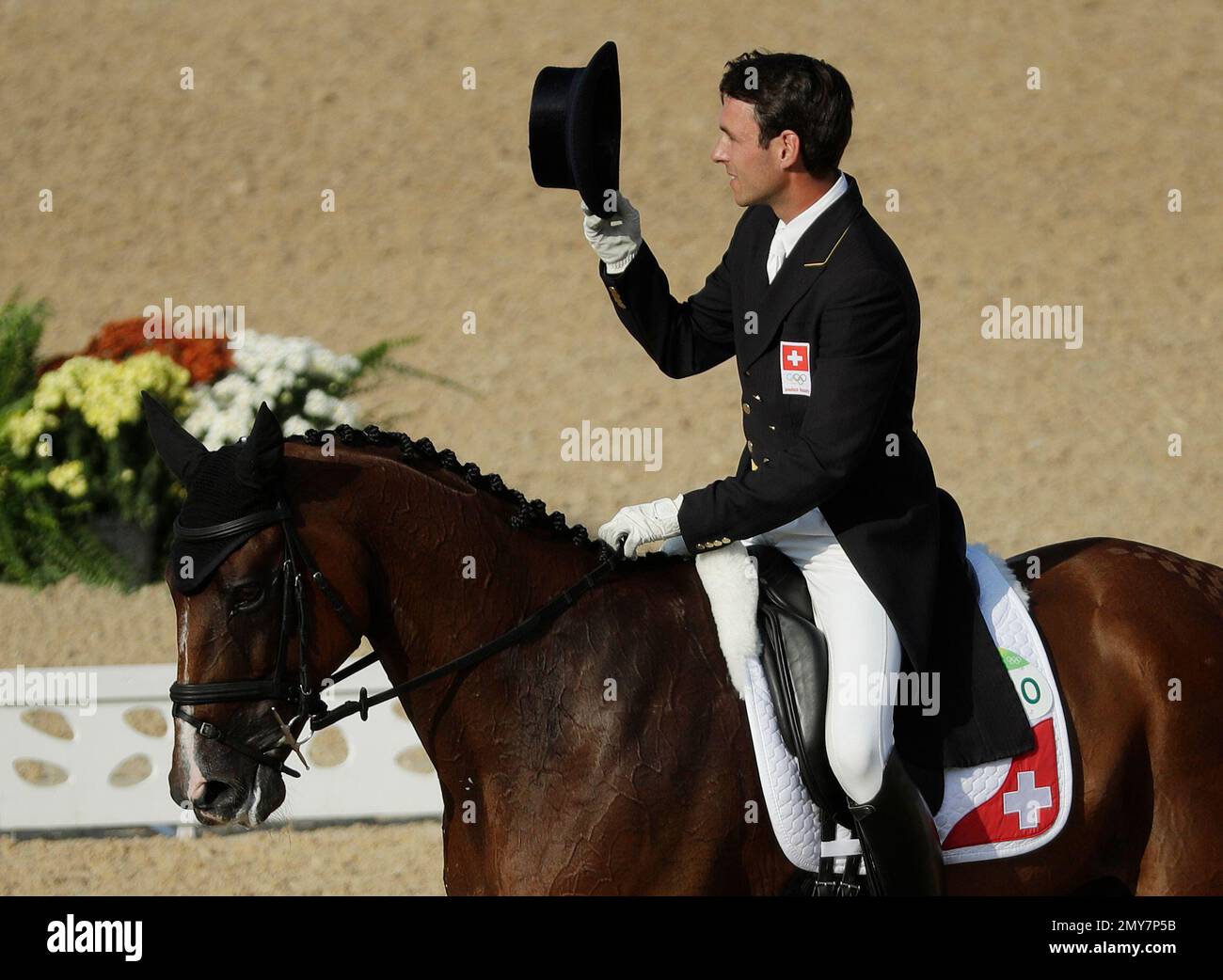 Felix Vogg, of Switzerland, reacts while riding Onfire after competing ...