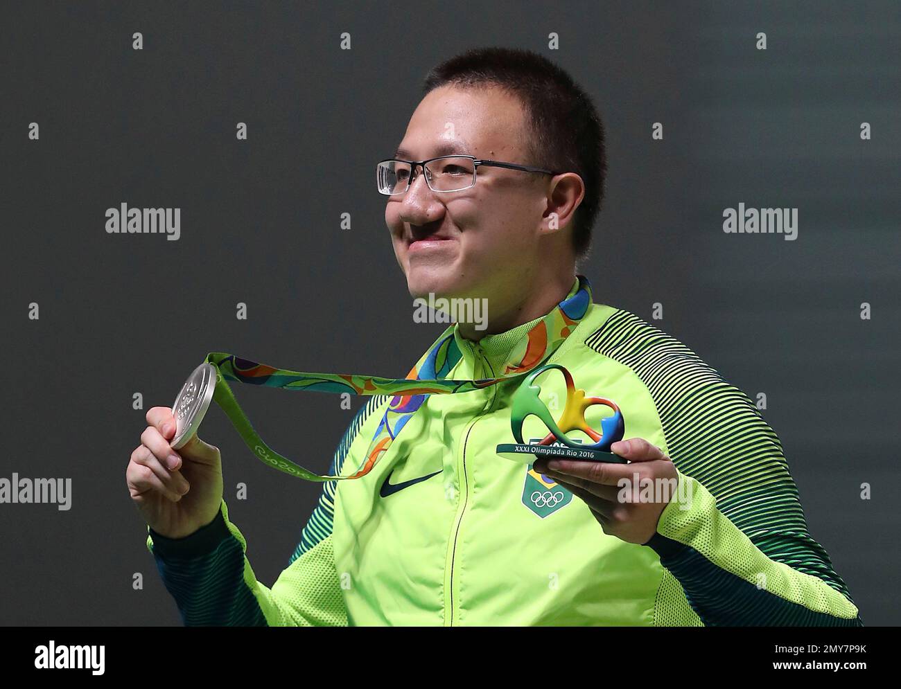 Felipe Wu of Brazil poses for photographers with his silver medal ...