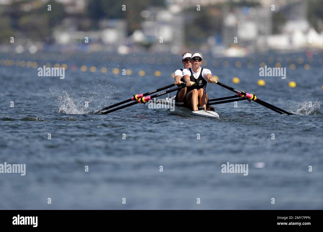 Eve Macfarlane and Zoe Stevenson, of New Zealand, compete in the women ...
