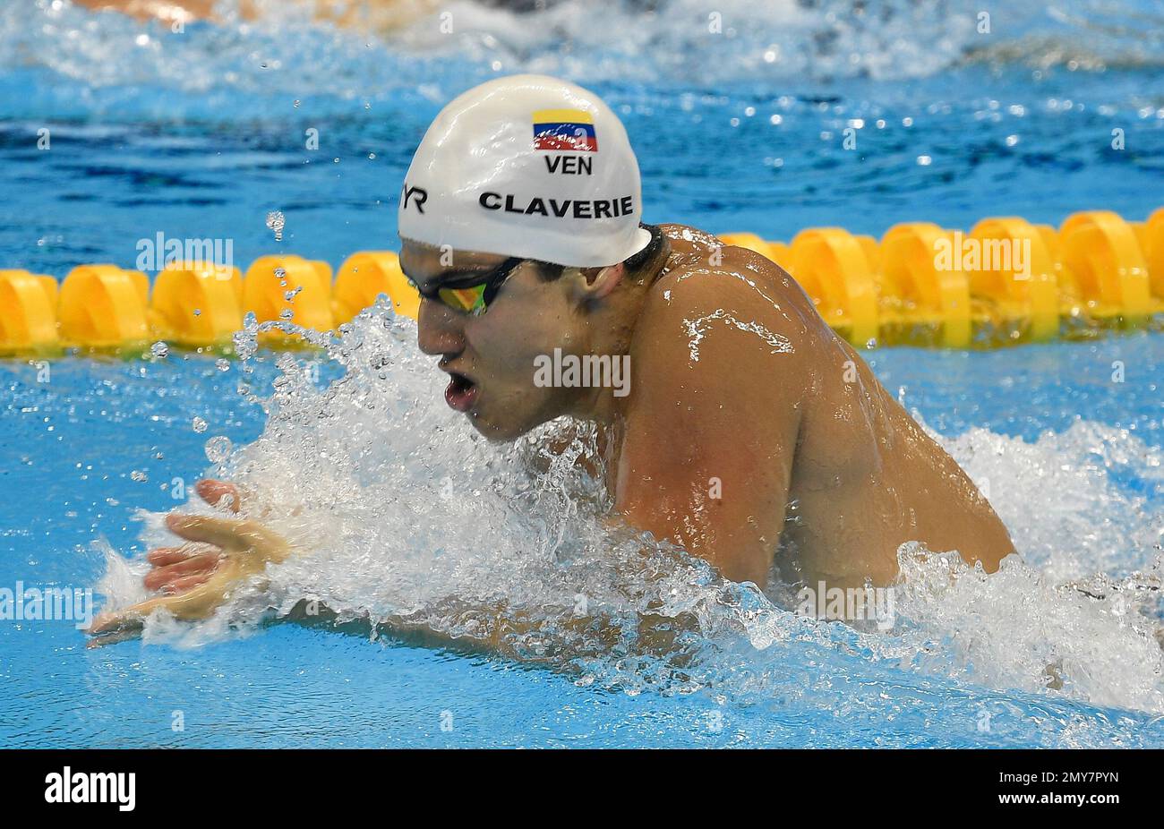 Venezuela's Carlos Claverie competes in a men's 100-meter breaststroke ...