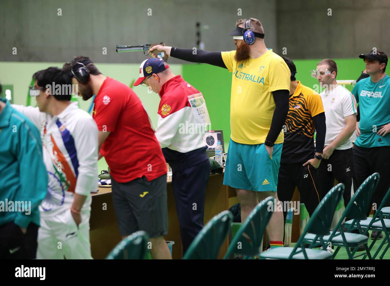 Athletes compete during the men's 10-meter air pistol qualification at ...