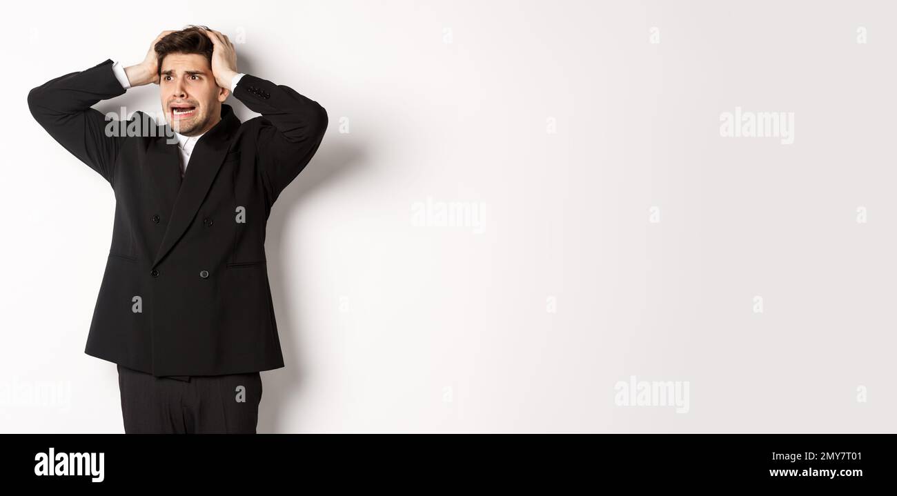 Image of anxious businessman start to panic, looking left with worried ...